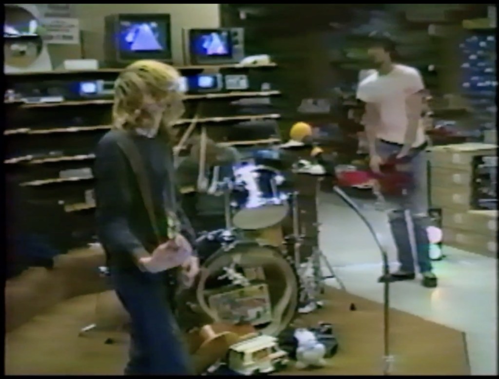 watch unearthed footage of nirvana performing at a radioshack in 1988